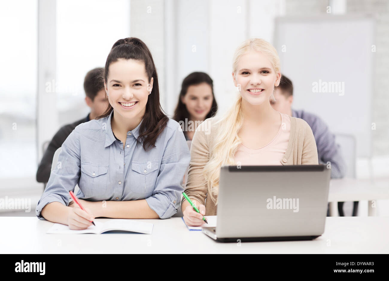 students with laptop and notebooks at school Stock Photo - Alamy