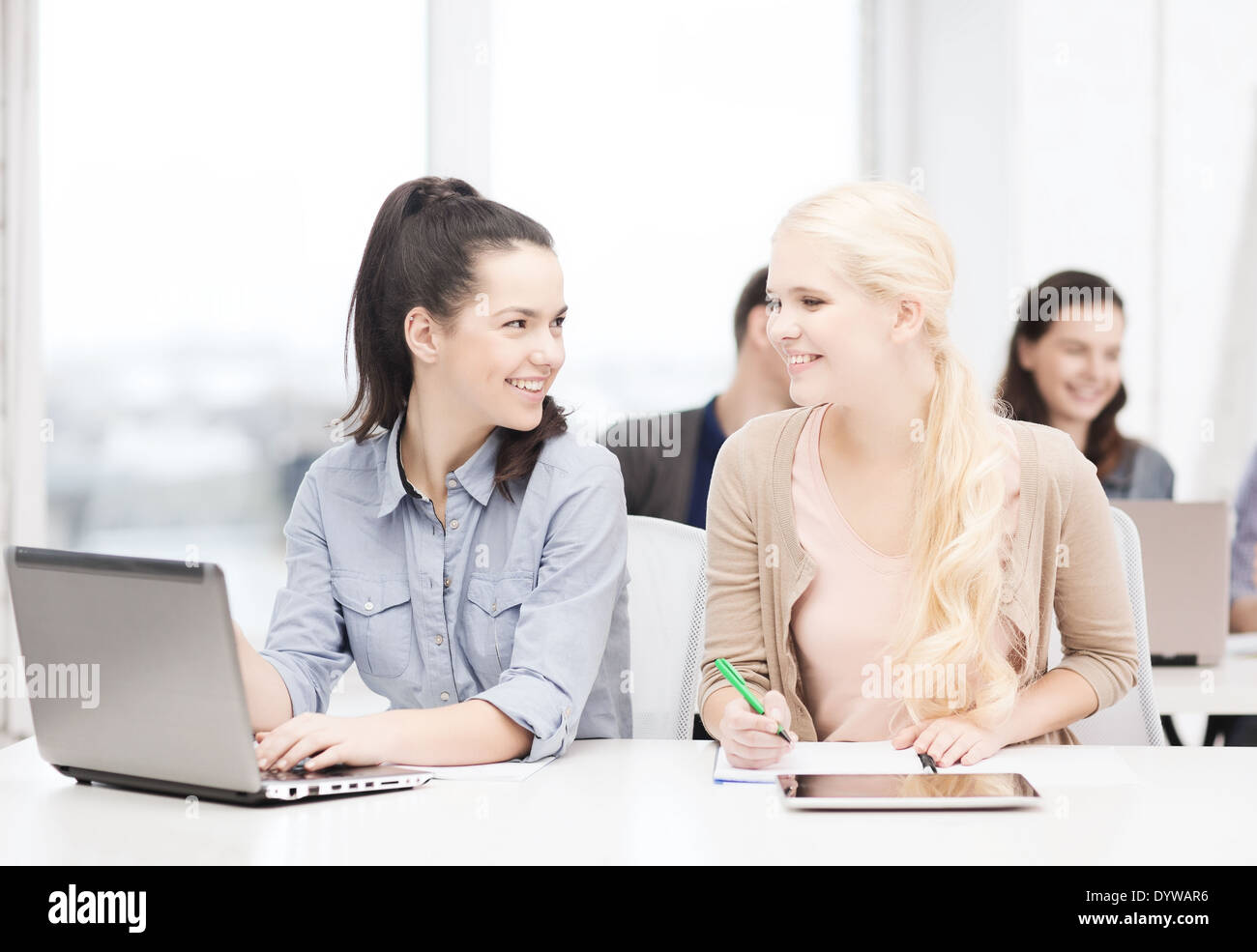 students with laptop, tablet pc and notebooks Stock Photo - Alamy