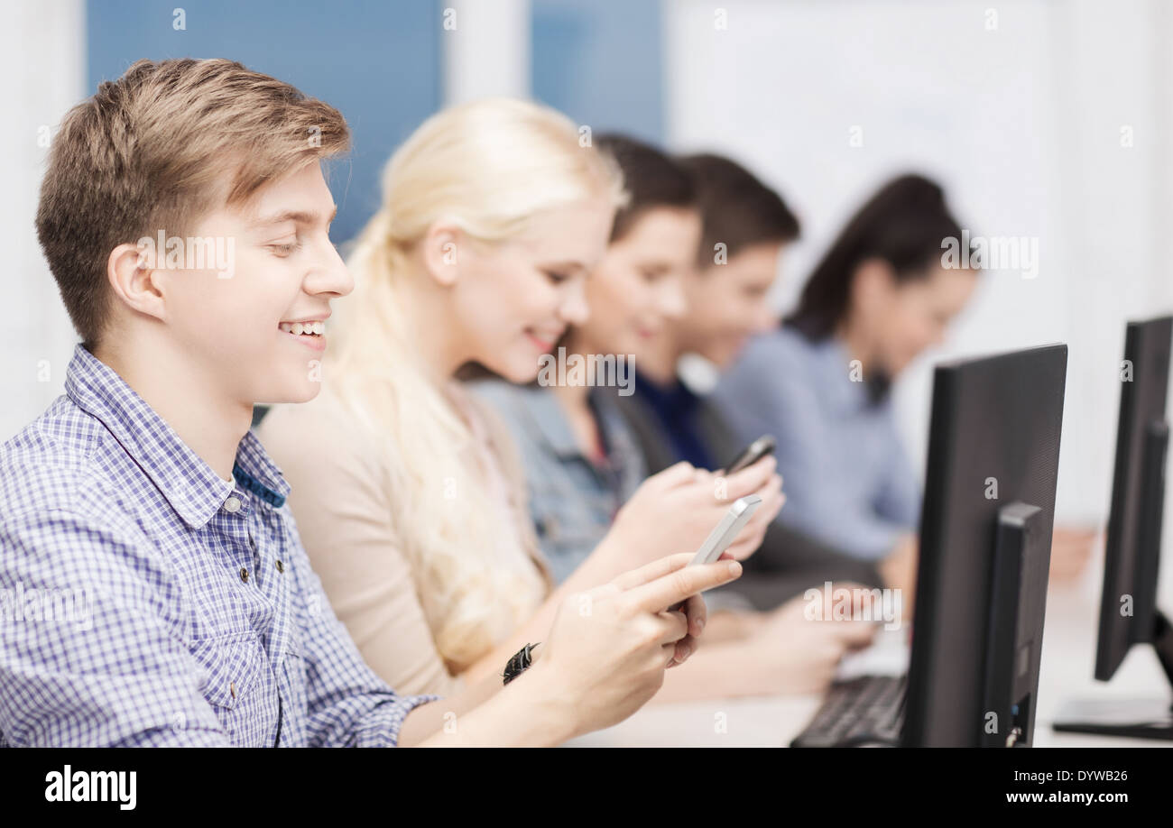 students with computer monitor and smartphones Stock Photo - Alamy