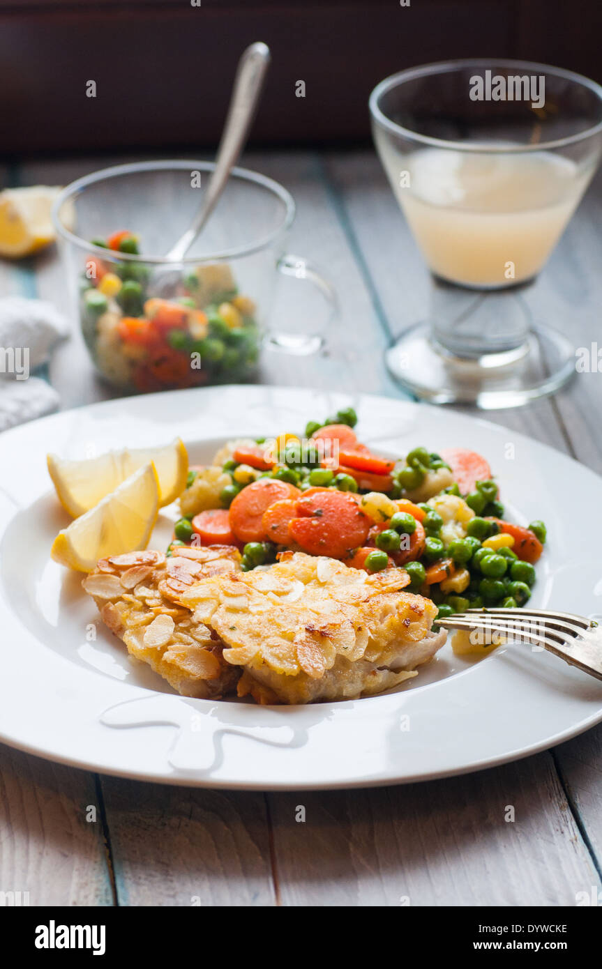 Poznan, Poland, fish breaded with almonds vegetables Stock Photo - Alamy