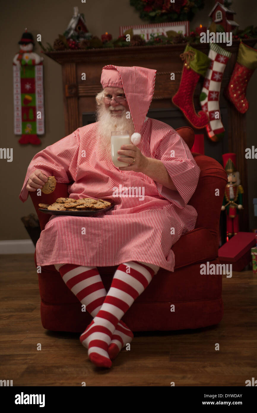 Santa resting after delivering toys on Christmas Eve Stock Photo - Alamy