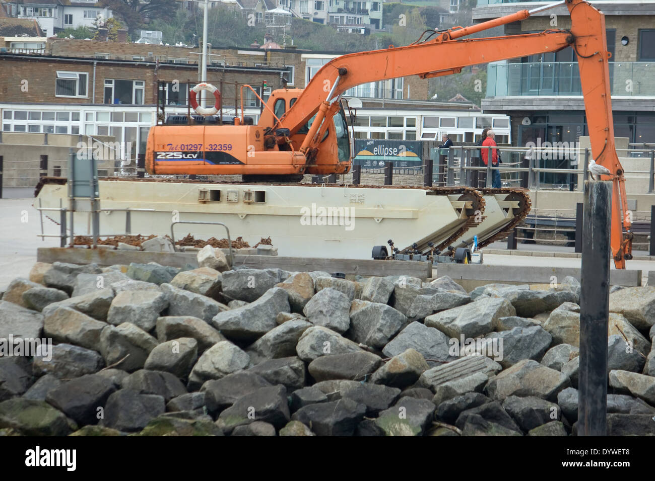 Mechanical digger at West Bay,Dorset Stock Photo - Alamy