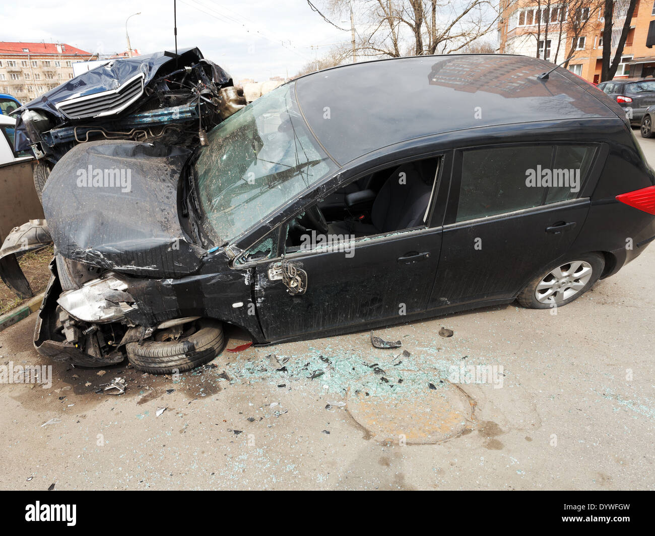 car broken during road accident on urban street Stock Photo - Alamy