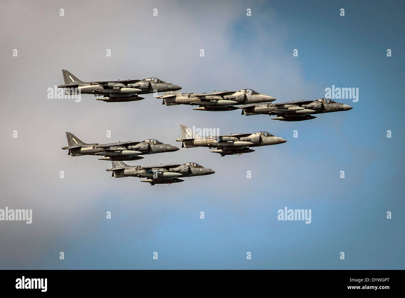 A formation of US Marine Corps AV-8B Harrier II fighter aircraft fly ...