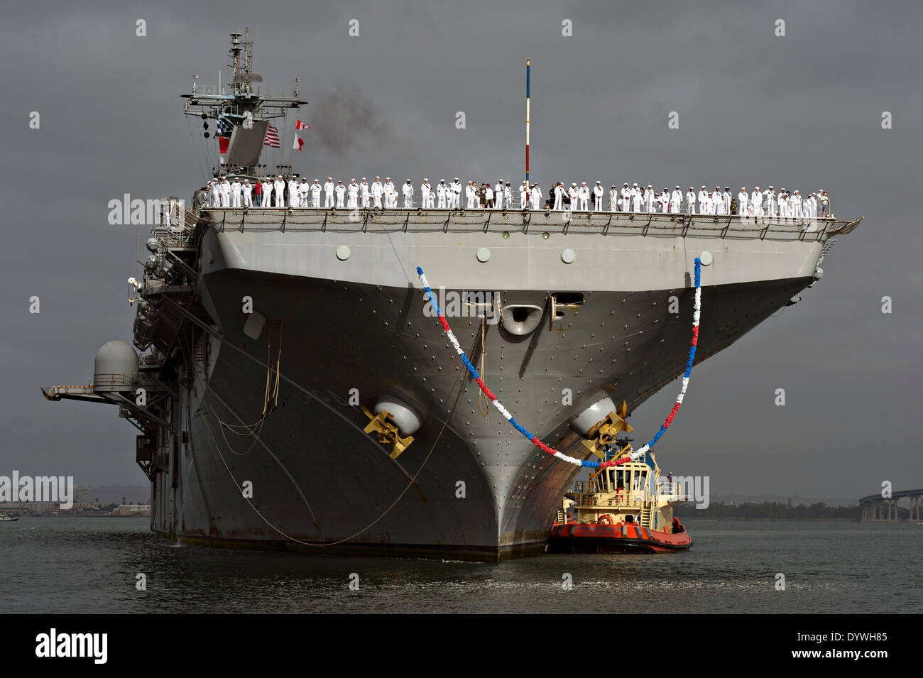 US Navy amphibious assault ship USS Boxer sailors man the rails as they ...