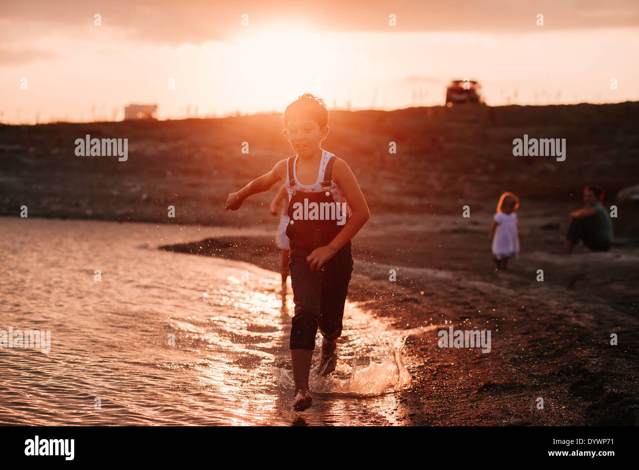 Three Children Running Along Beach Stock Photo - Alamy Three Children Running Along Beach Stock Photo - Alamy