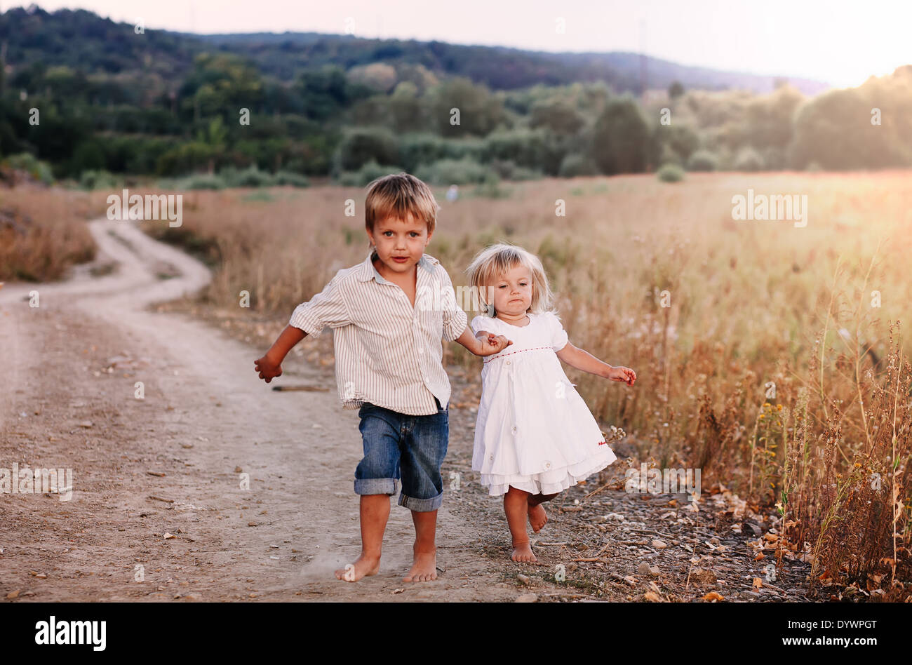 four children running outdoor Stock Photo - Alamy