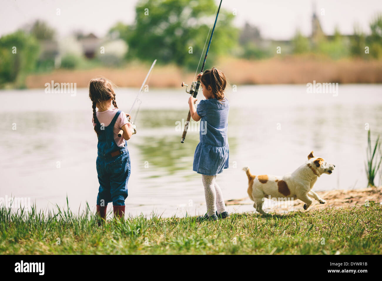 Two little girls fishing Stock Photo - Alamy