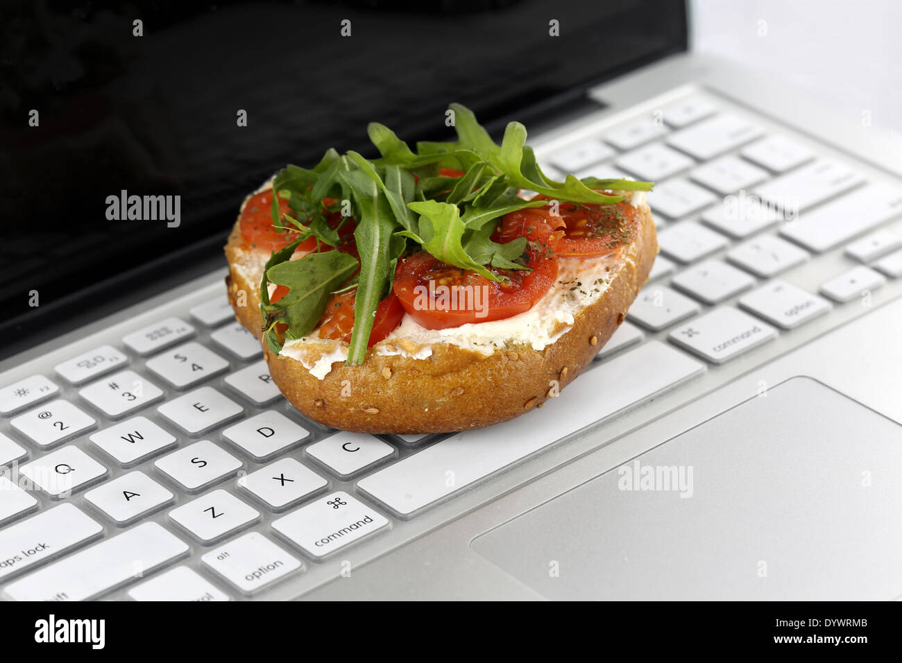 Eating at work Stock Photo - Alamy