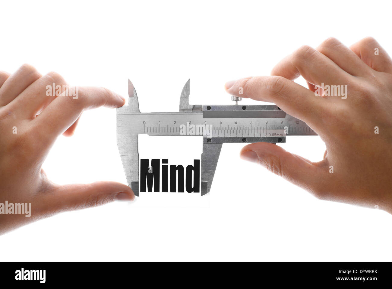 Two hands holding a caliper, measuring the word "Mind Stock Photo - Alamy
