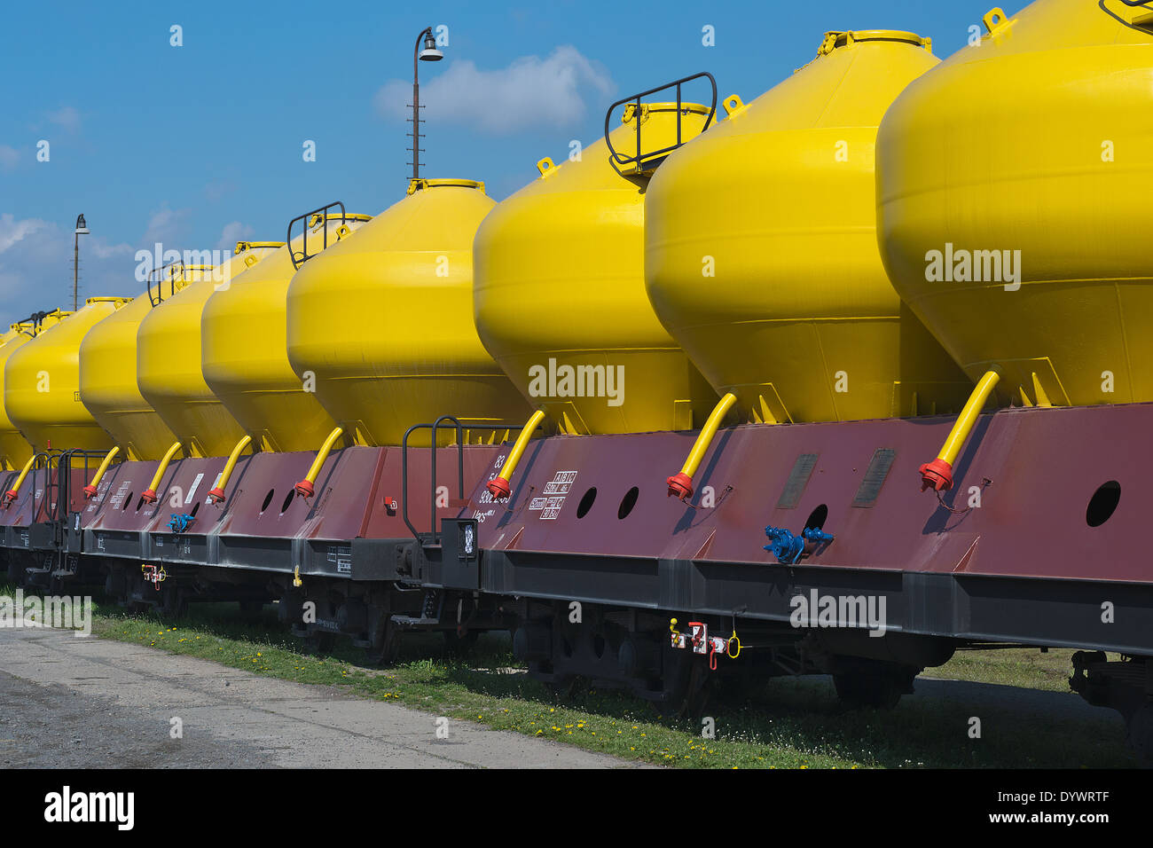 Freight Train with yellow tanks sitting on railroad tracks Stock Photo ...