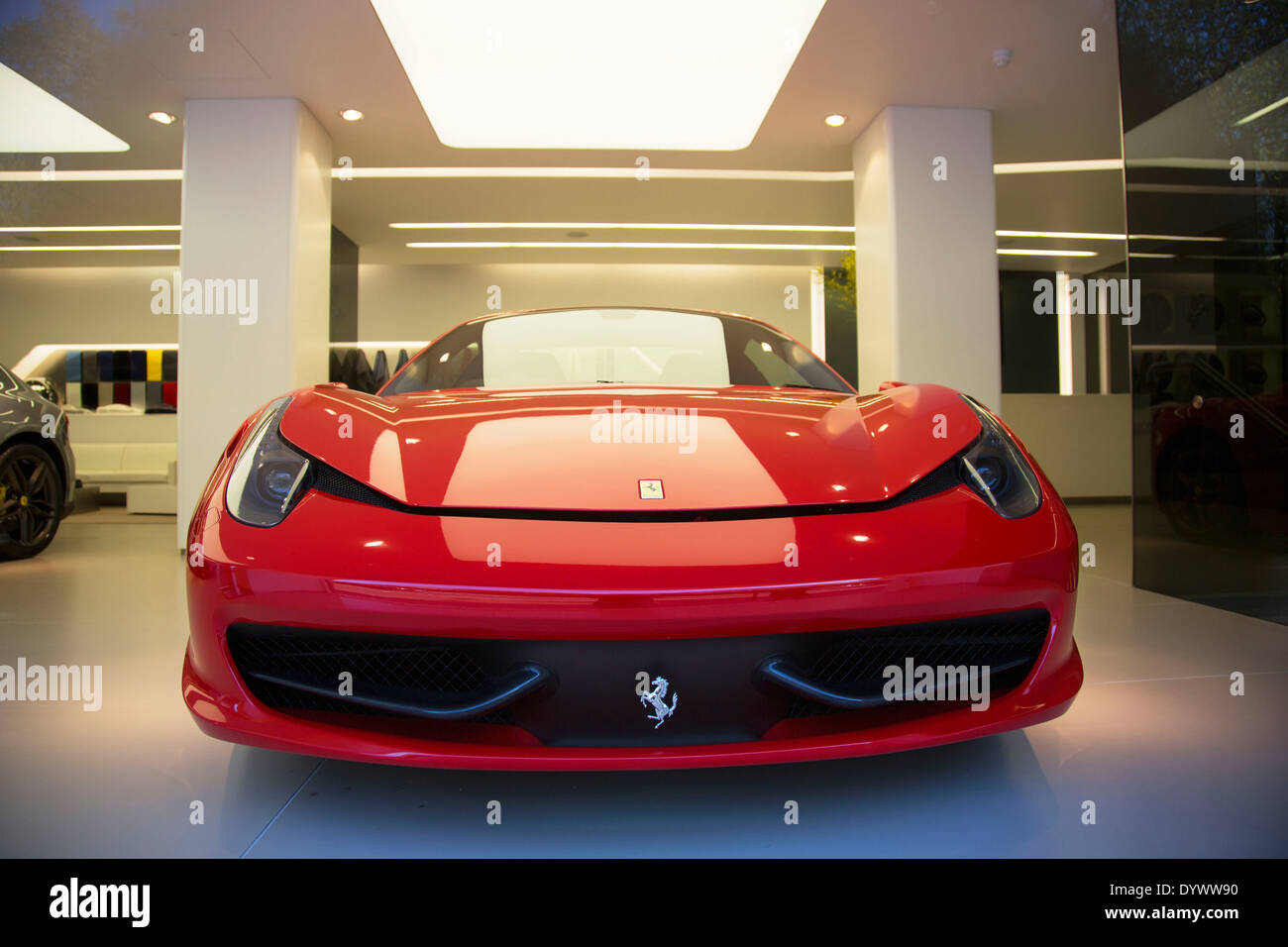 Red Ferrari in a Ferrari showroom in the exclusive area of ...