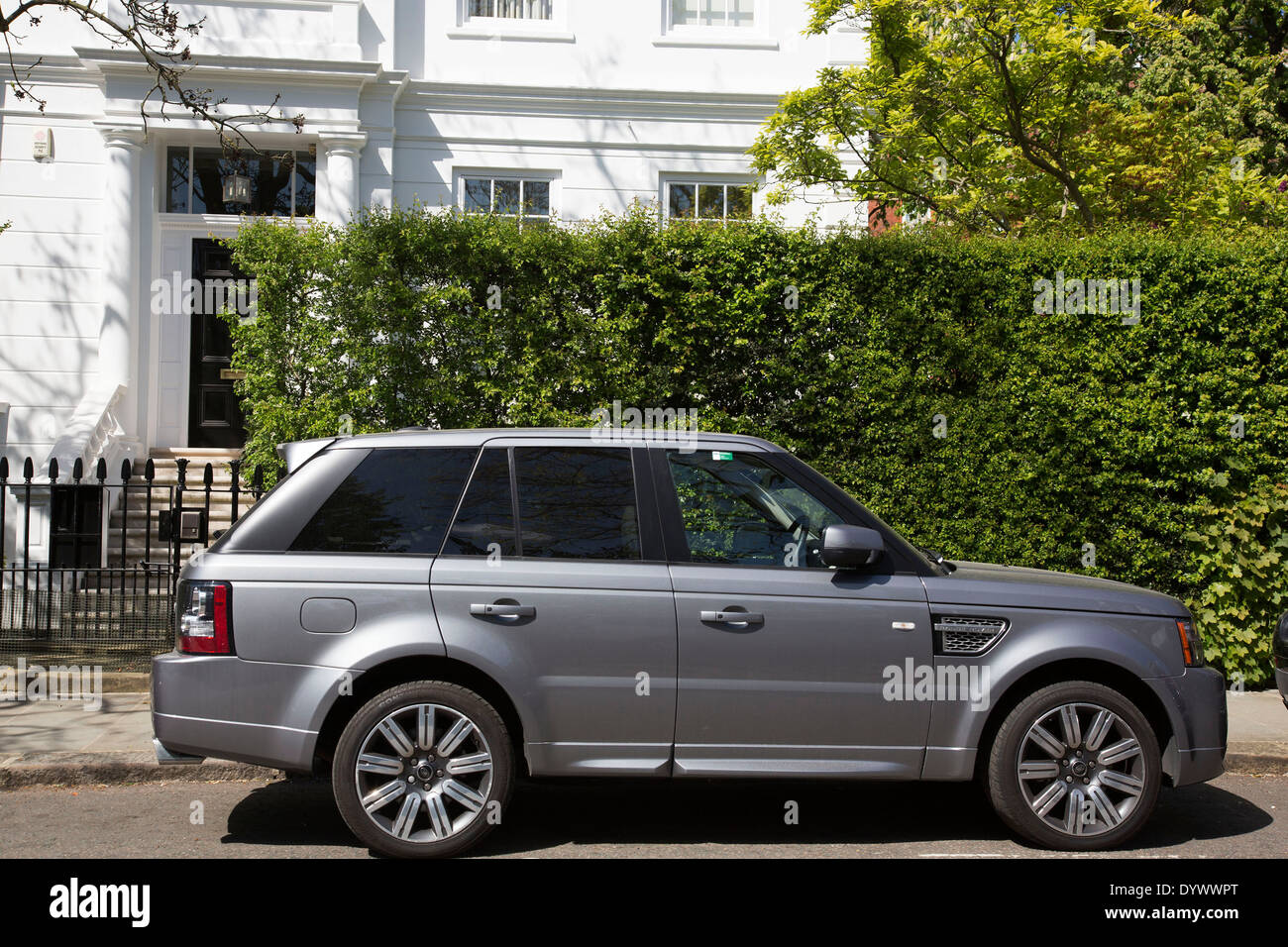 Range Rover SUV parked in an exclusive residential street scene in ...