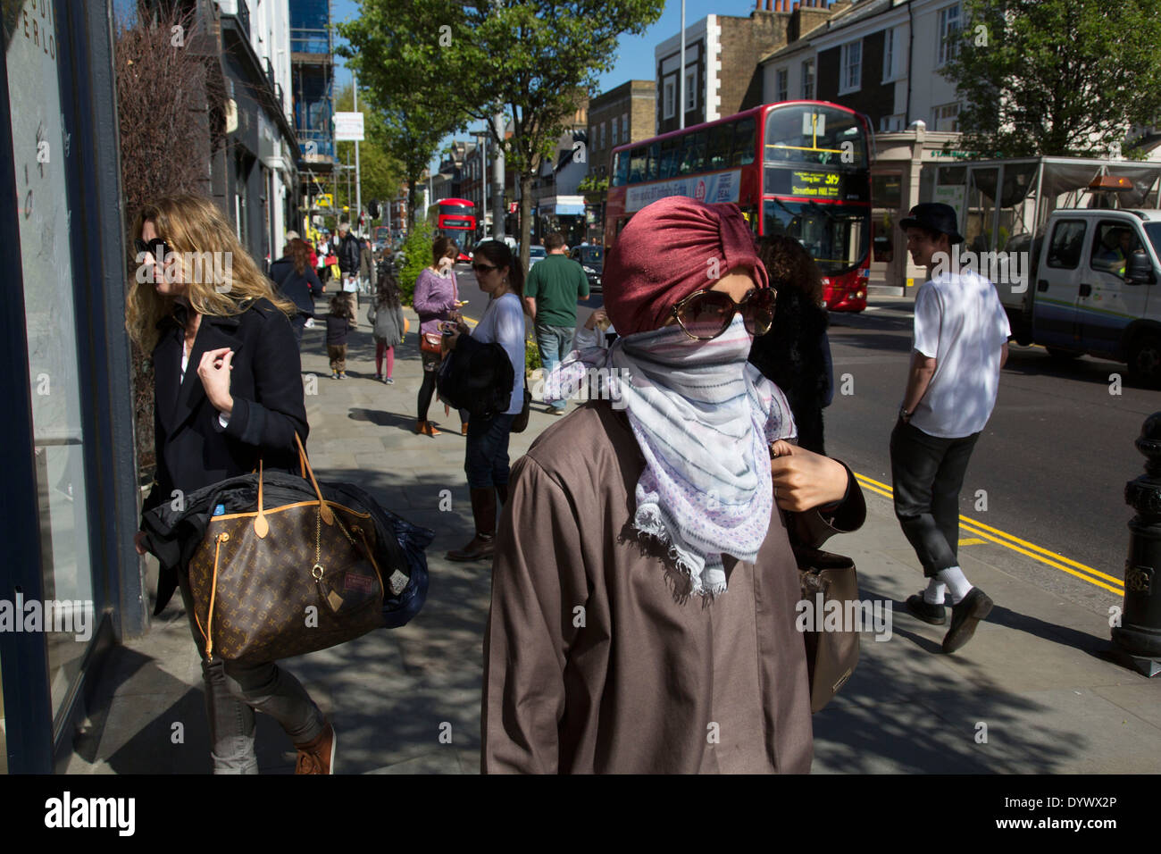 Woman in disguise, protecting her identity on the Kings Road in Chelsea ...