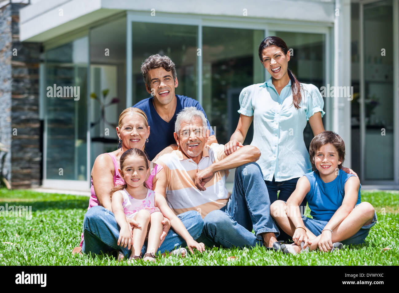 Family in big house Stock Photo - Alamy