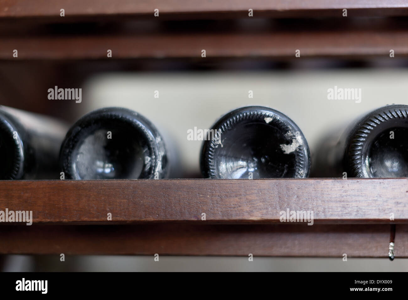 some very old and dusty wine bottles in a wine cellar Stock Photo - Alamy