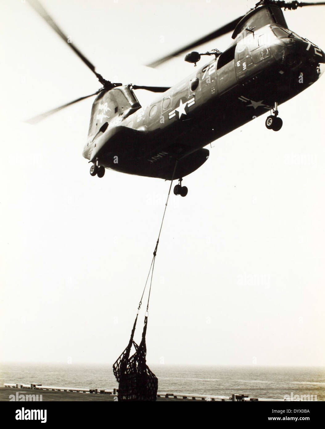 The H-46 helicopter, shown in this photo, is transporting cargo as part ...
