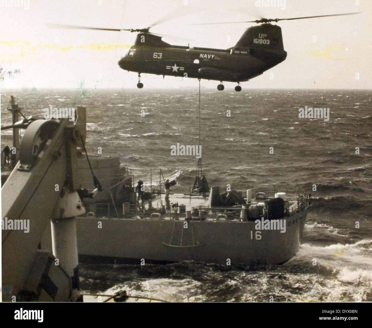 The Sikorsky H-46 (BuNo 151903) is shown here transporting a cargo load ...