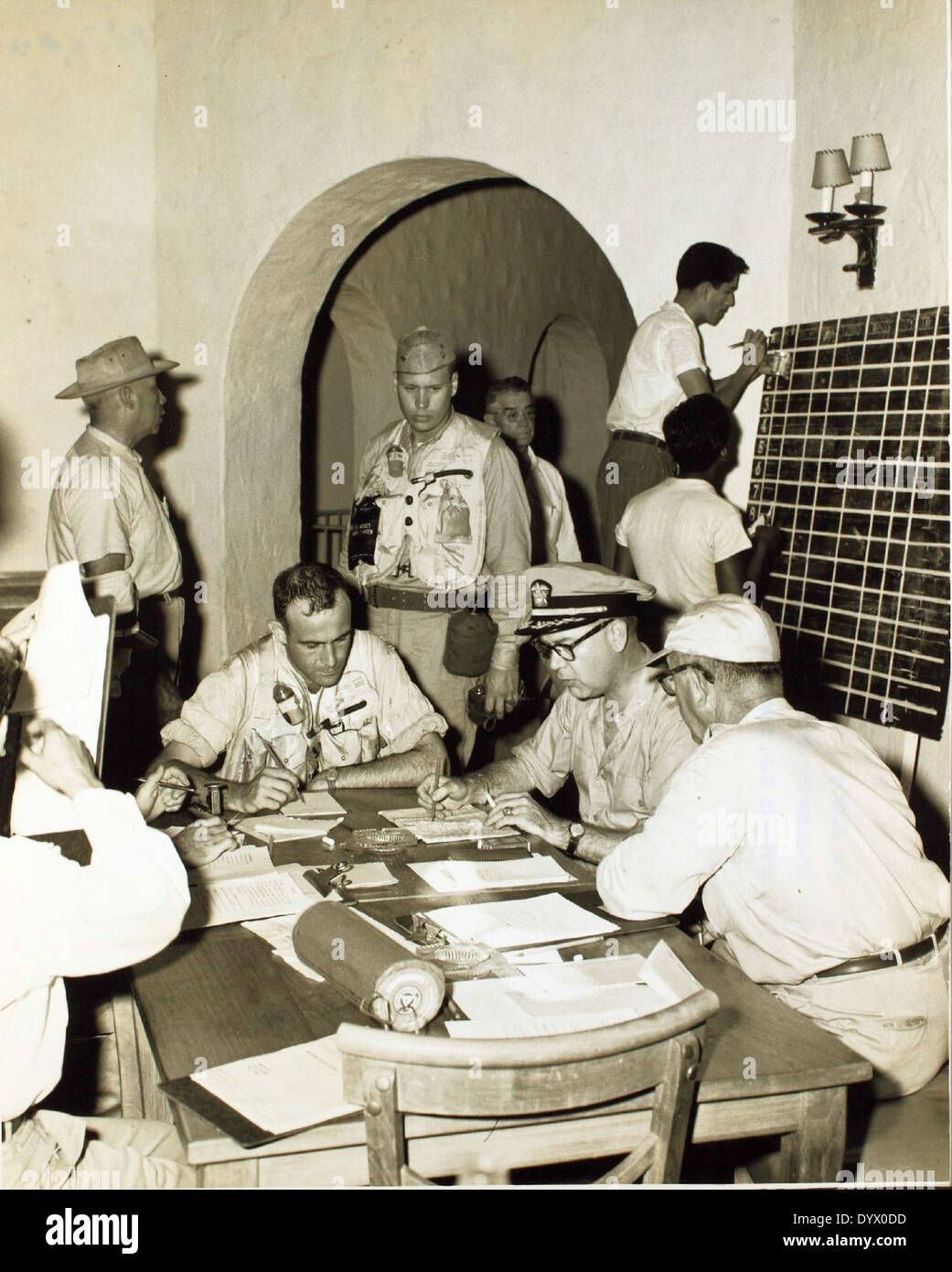 This photo depicts a debriefing session for a pilot in an operations ...