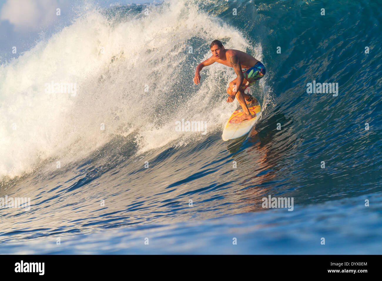 Surfing a wave Stock Photo - Alamy