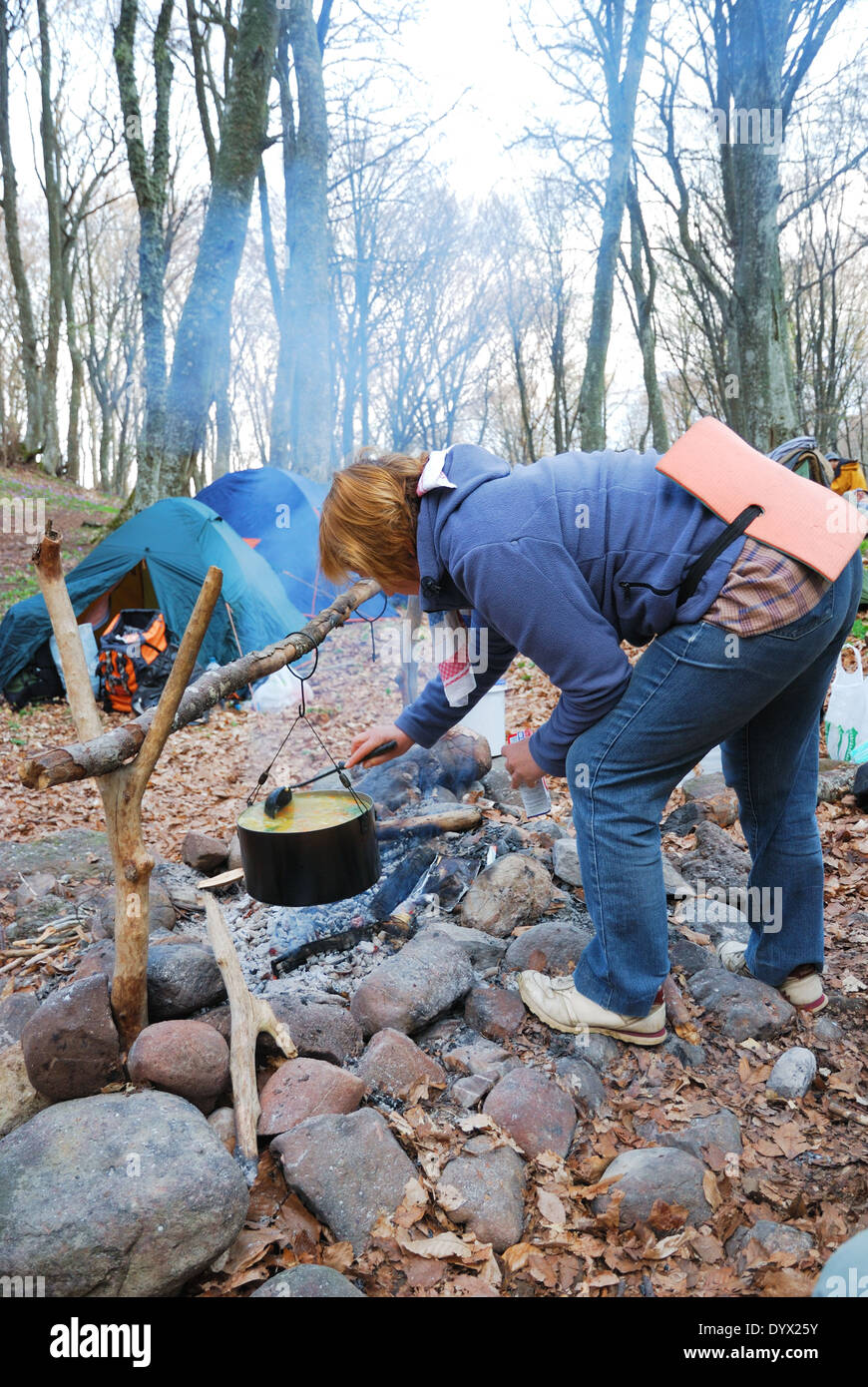 Woman cooking over fire hi-res stock photography and images - Alamy