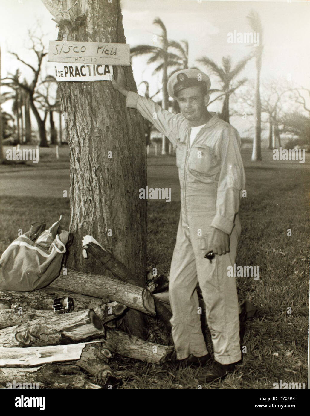 Justin T. Sisco, a Navy chief aviation machinist, is pictured beside a ...