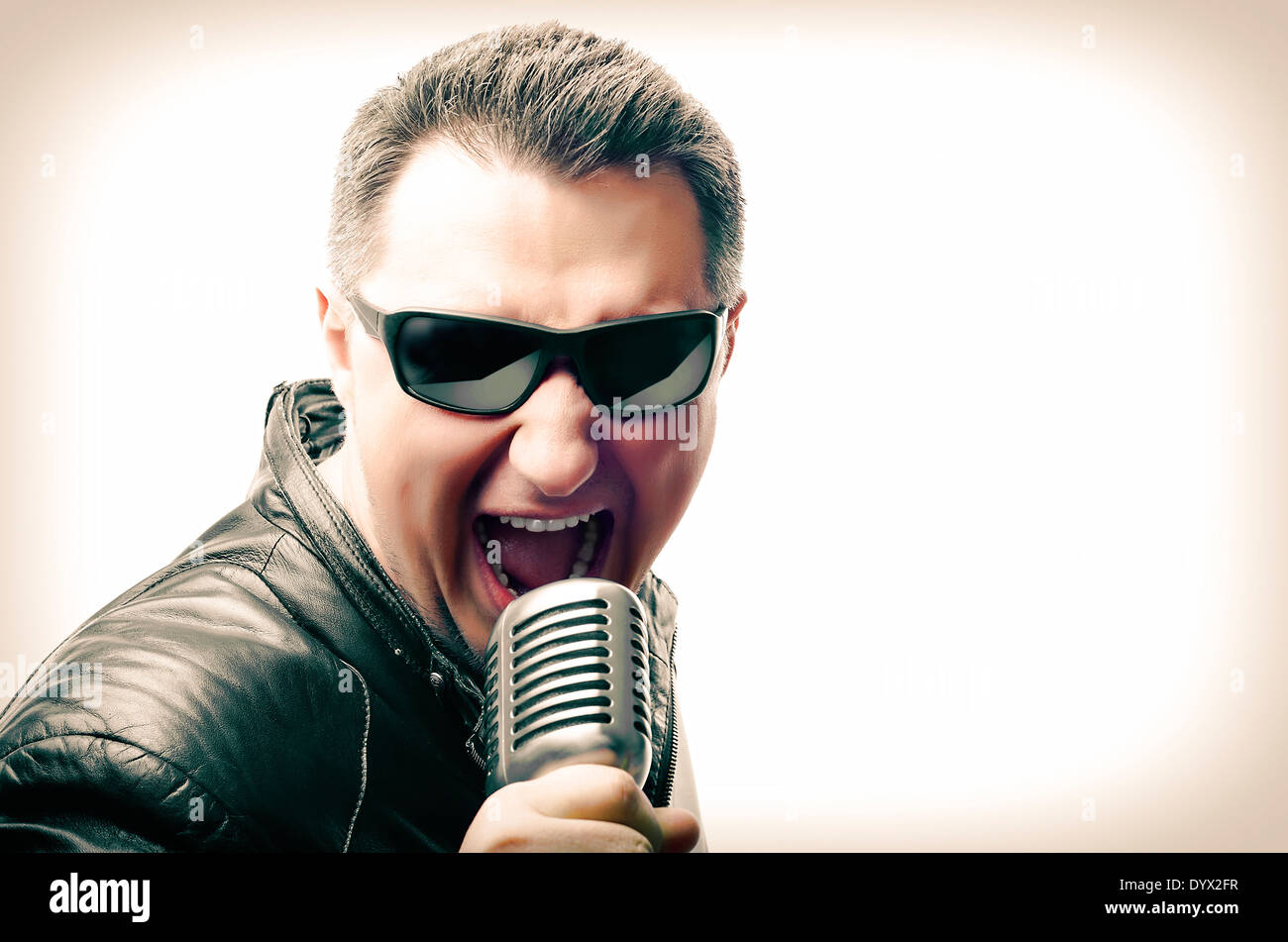 Rock singer and microphone. Vintage photo Stock Photo - Alamy