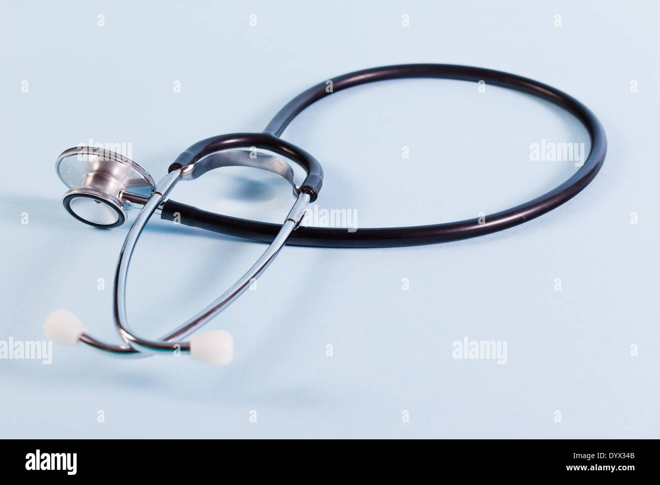 Stethoscope on light blue background Stock Photo - Alamy