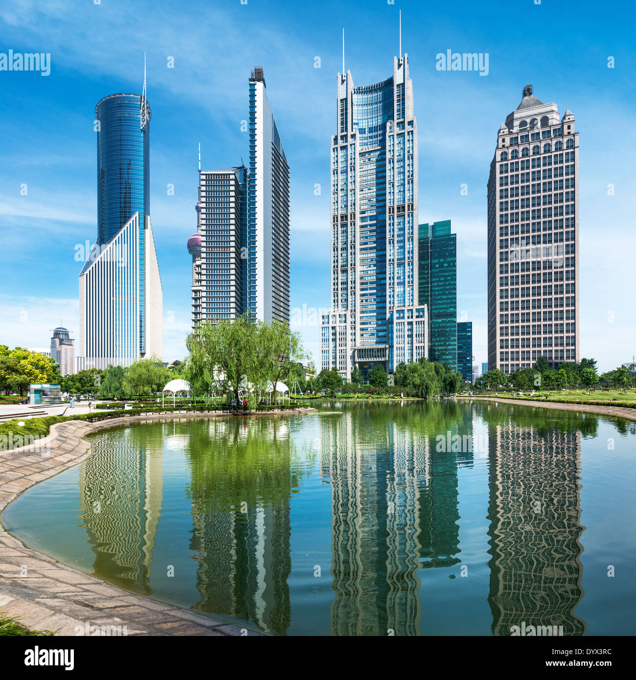 park and skyscrapers under the blue sky in shanghai Stock Photo - Alamy