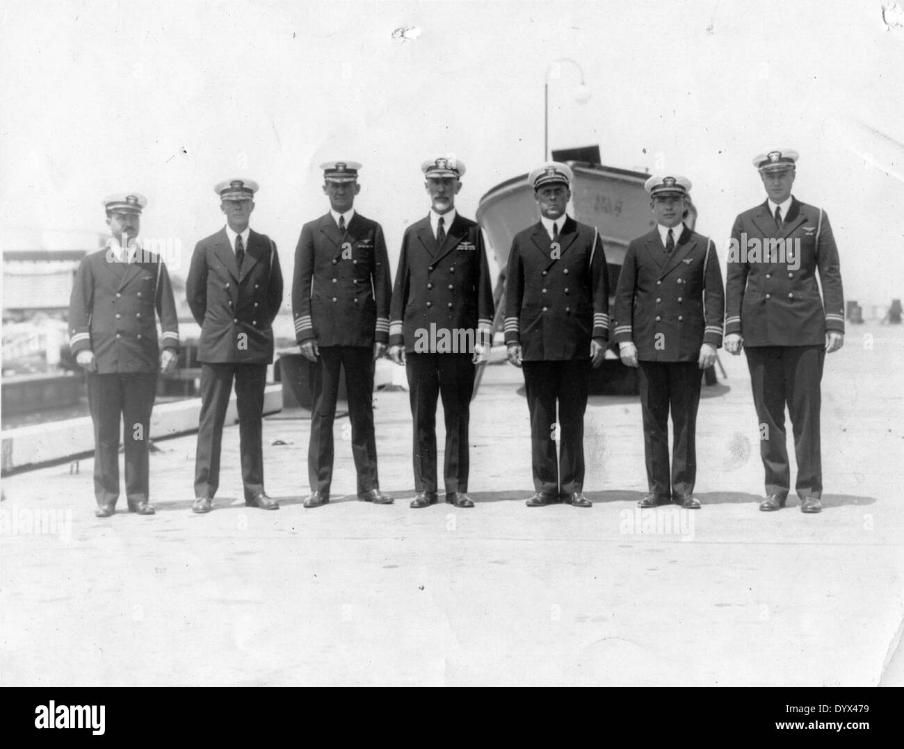 This image shows Admiral Reeves, Captain McCrary, and their staff in a ...
