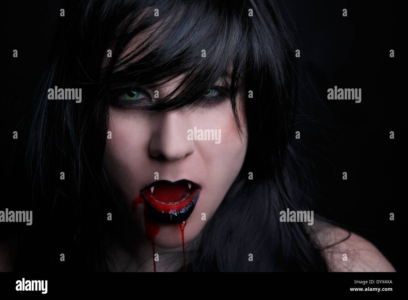 Female vampire with bloody mouth Stock Photo - Alamy