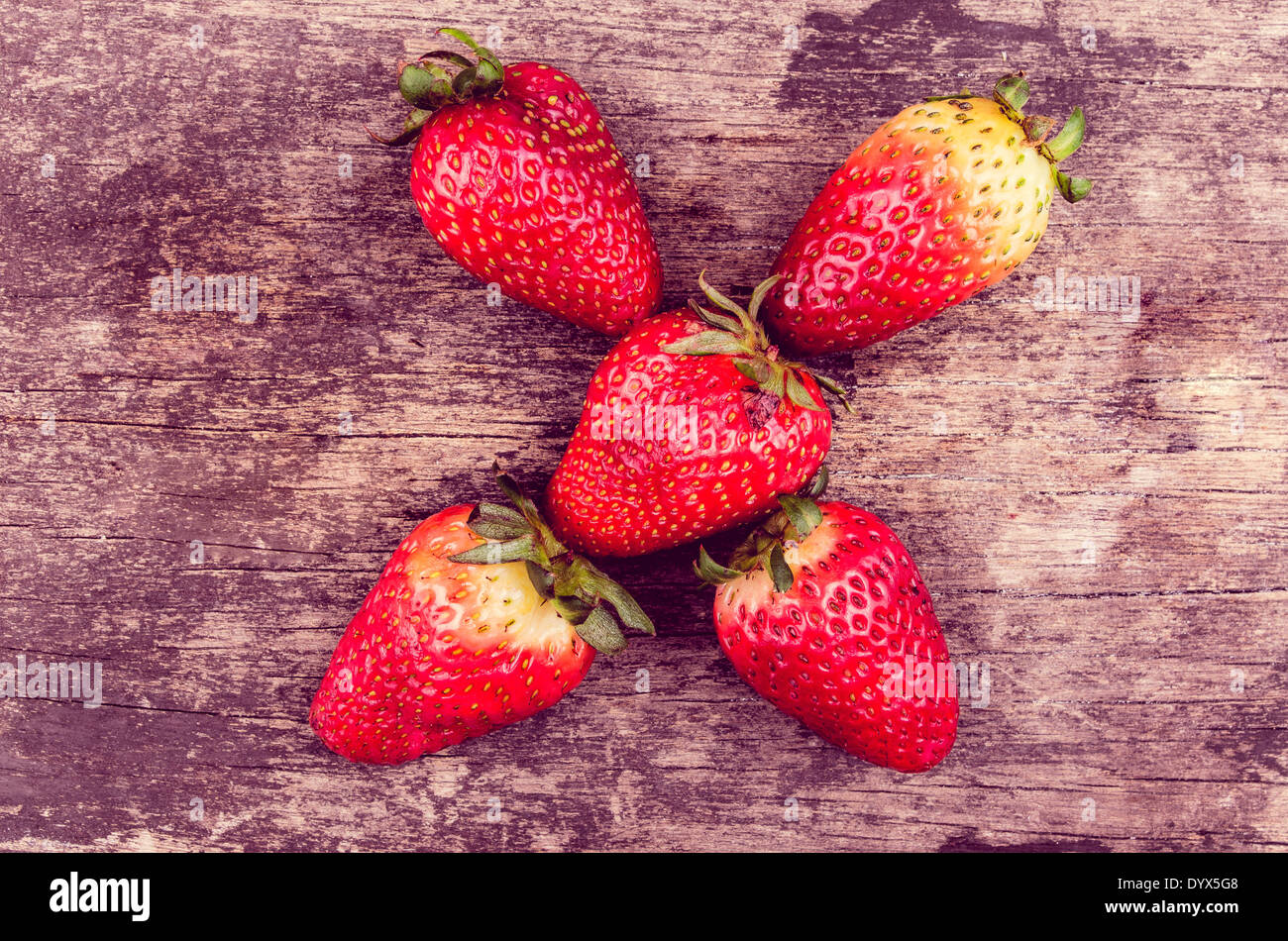 strawberries on wood forming shape Stock Photo - Alamy