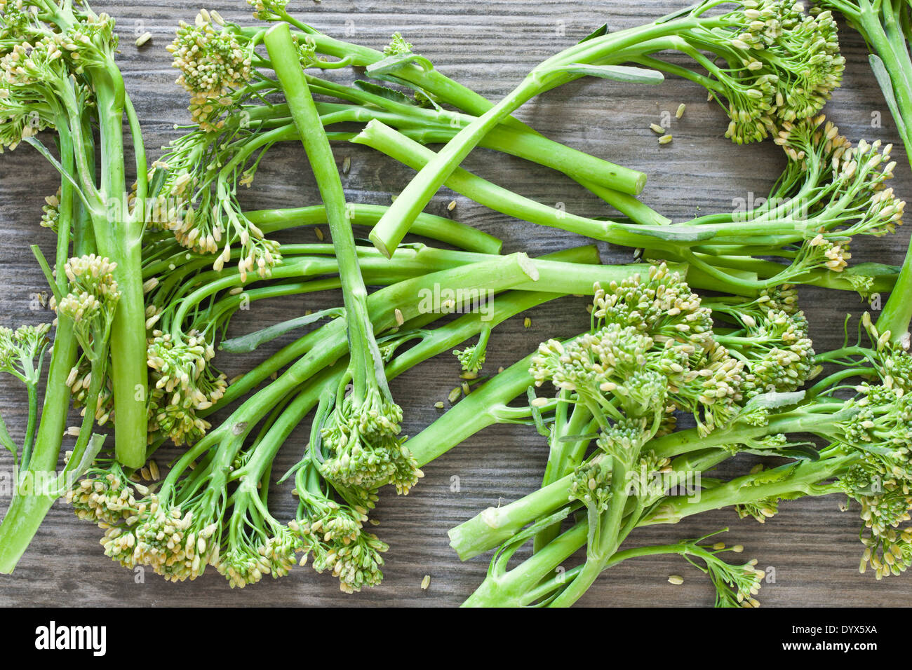 Fresh broccoli stems on a wood surface Stock Photo - Alamy
