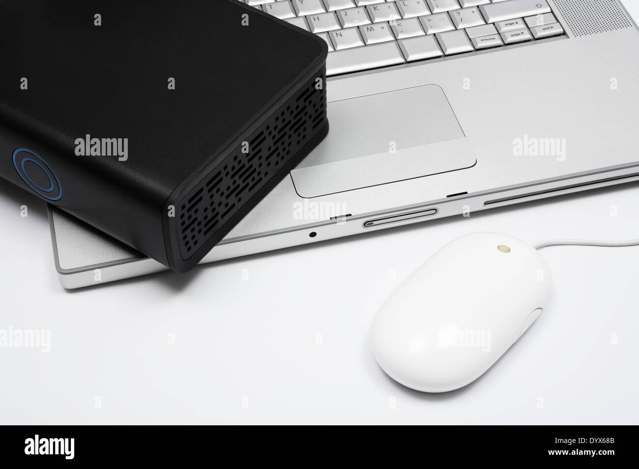 notebook, mouse and an external hard drive Stock Photo - Alamy