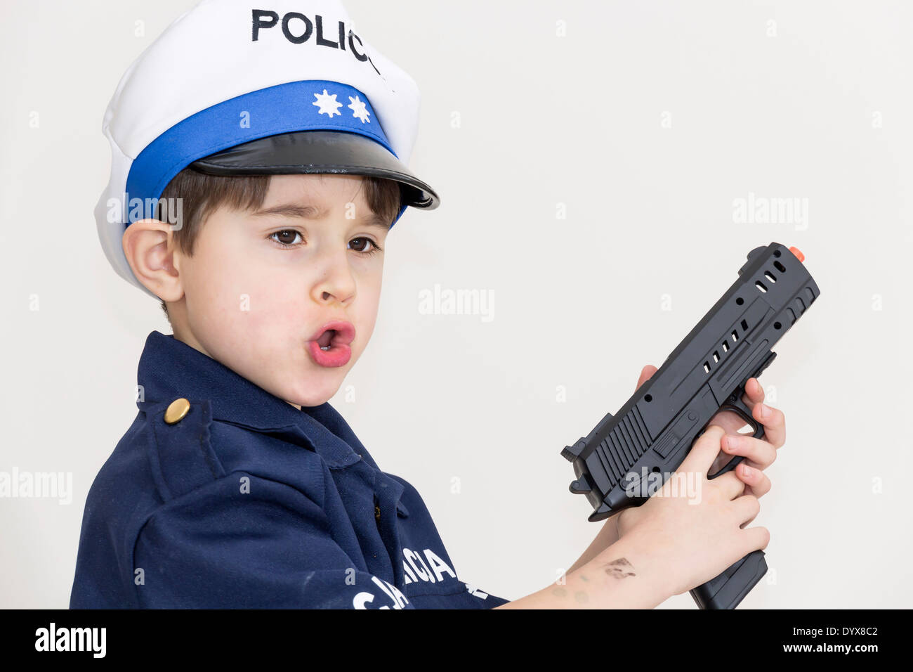 Boy age 6 boy pretending to be a police officer Stock Photo - Alamy