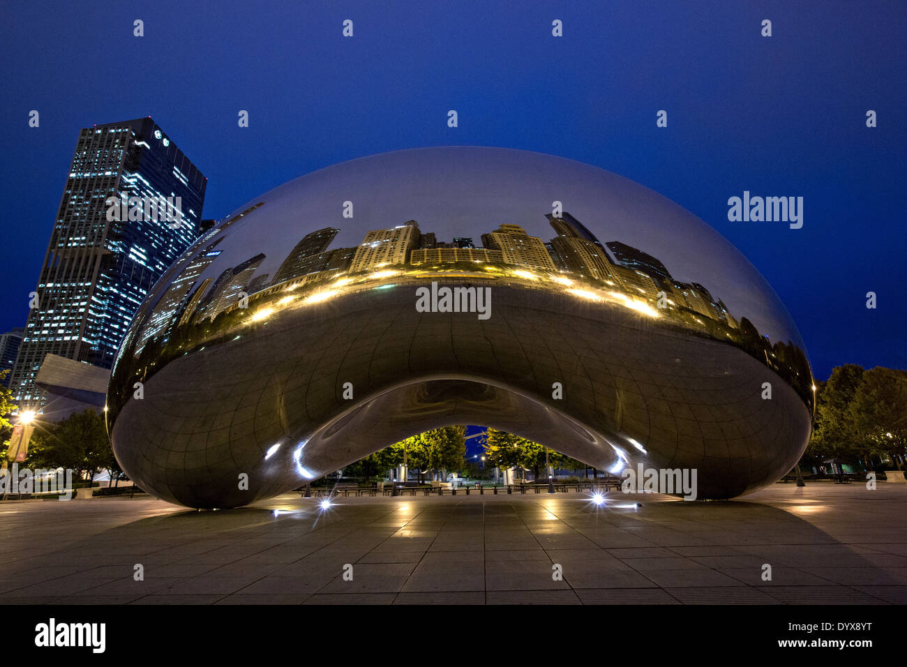 Cloud Gate Sculpture or The Bean with downtown skyline reflected in ...