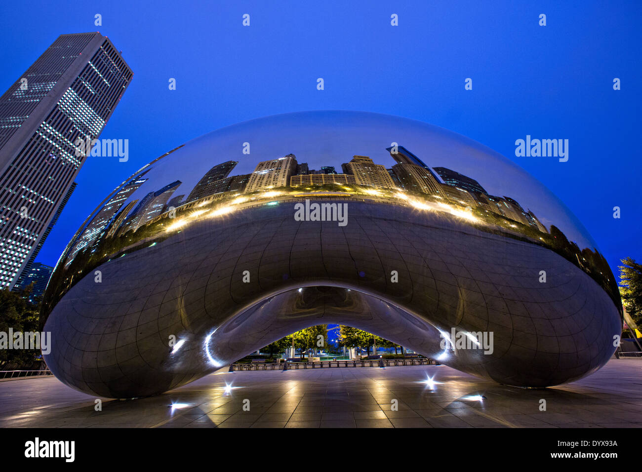 Cloud Gate Sculpture or The Bean with downtown skyline reflected in ...