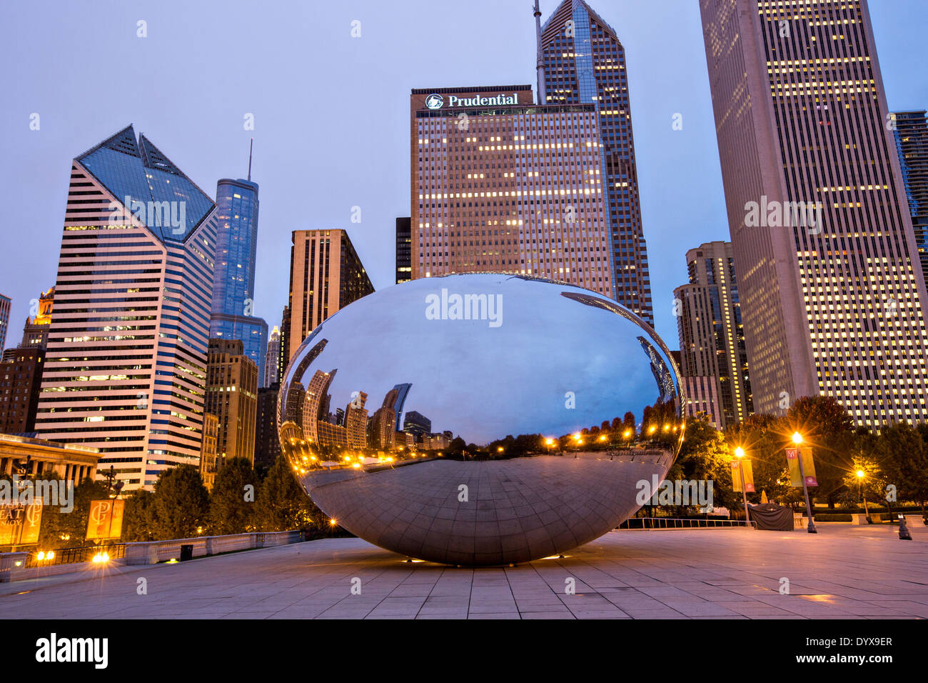 Cloud Gate Sculpture or The Bean with downtown skyline reflected in ...