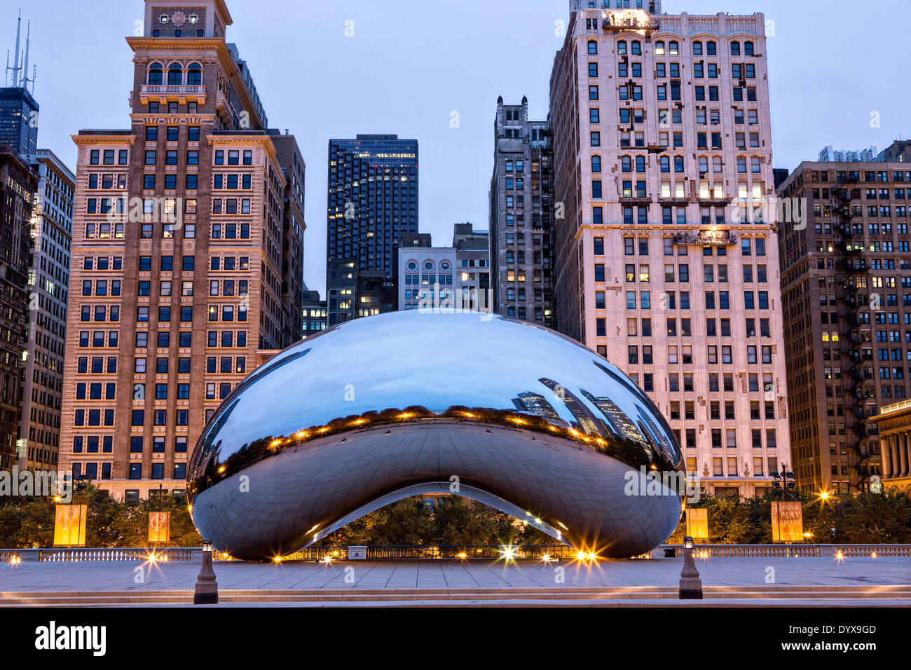 Cloud Gate Sculpture or The Bean with downtown skyline reflected in ...