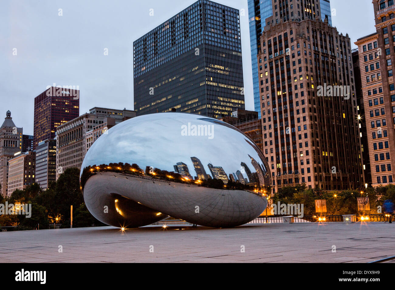 Cloud Gate Sculpture or The Bean with downtown skyline reflected in ...