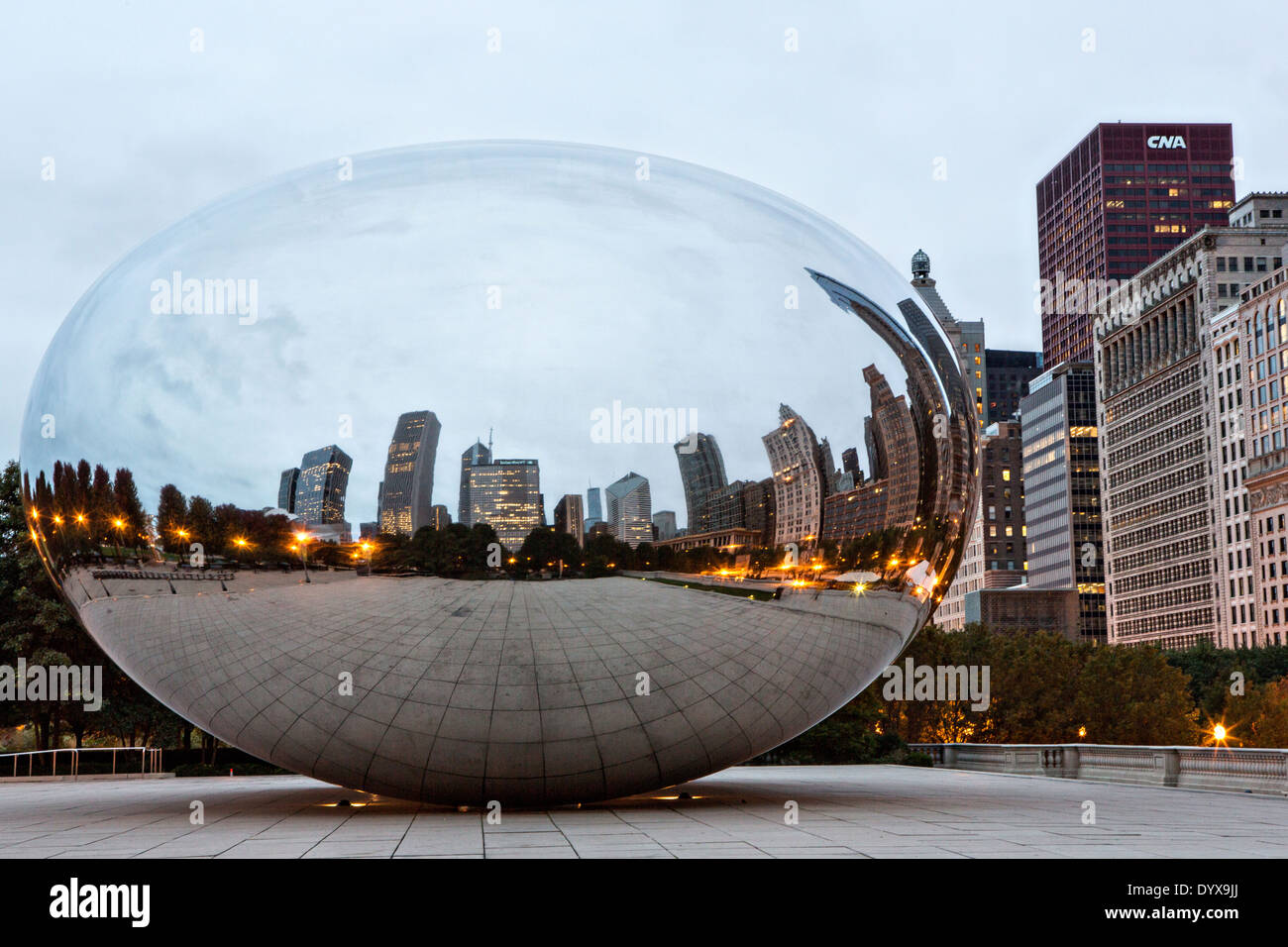 Cloud Gate Sculpture or The Bean with downtown skyline reflected in ...