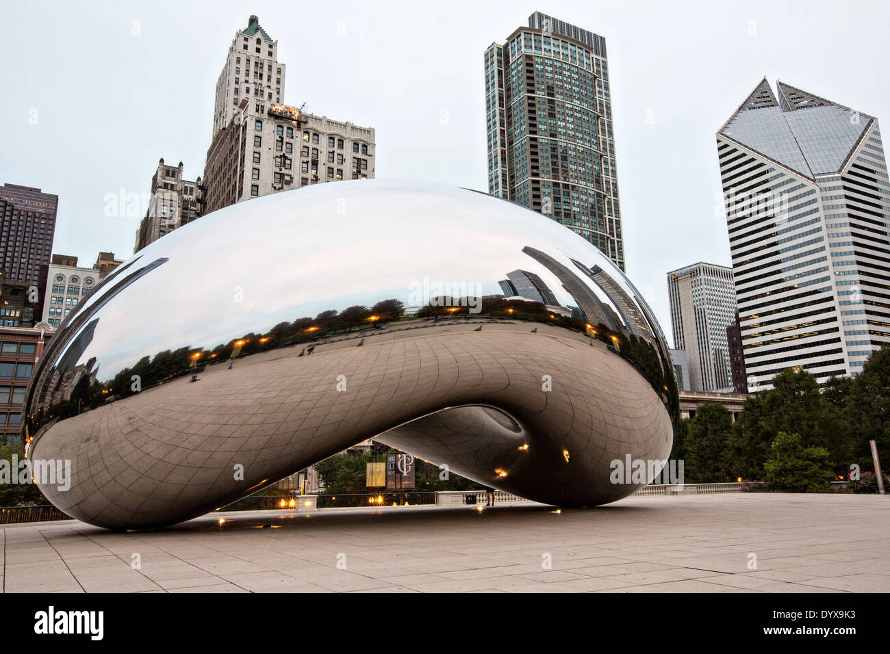 Cloud Gate Sculpture or The Bean with downtown skyline reflected in ...
