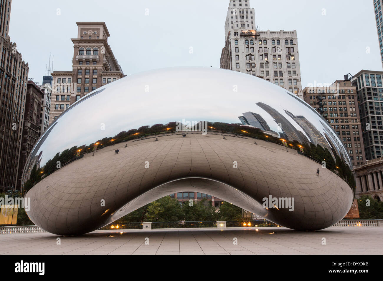 Cloud Gate Sculpture or The Bean with downtown skyline reflected in ...
