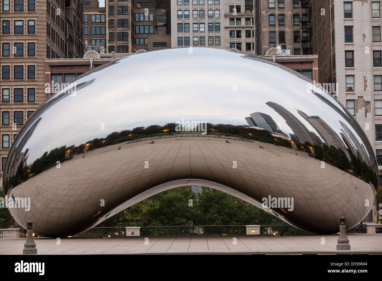 Cloud Gate Sculpture or The Bean with downtown skyline reflected in ...