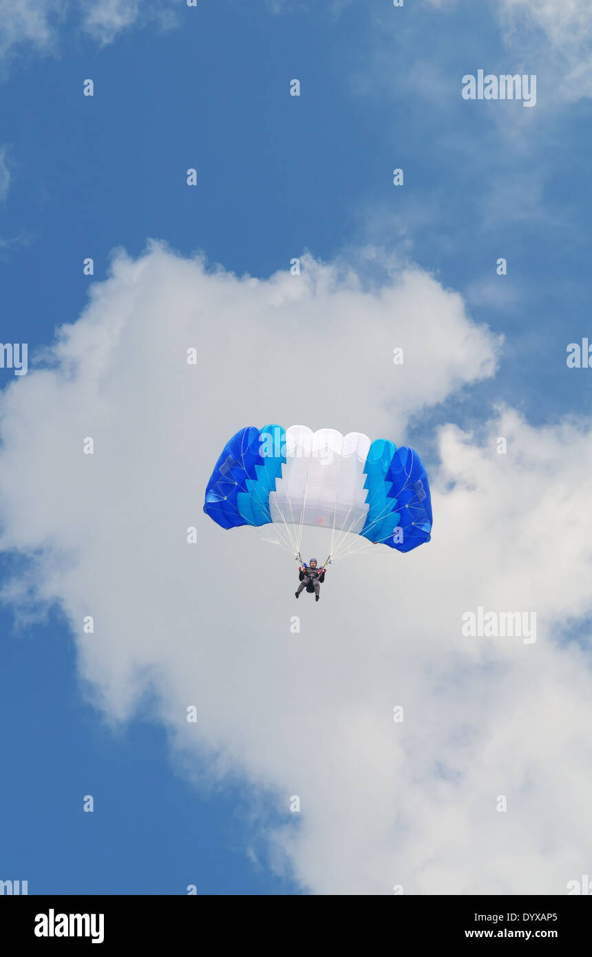 One day with parachutist in airfield. The skydiver lands under the ...