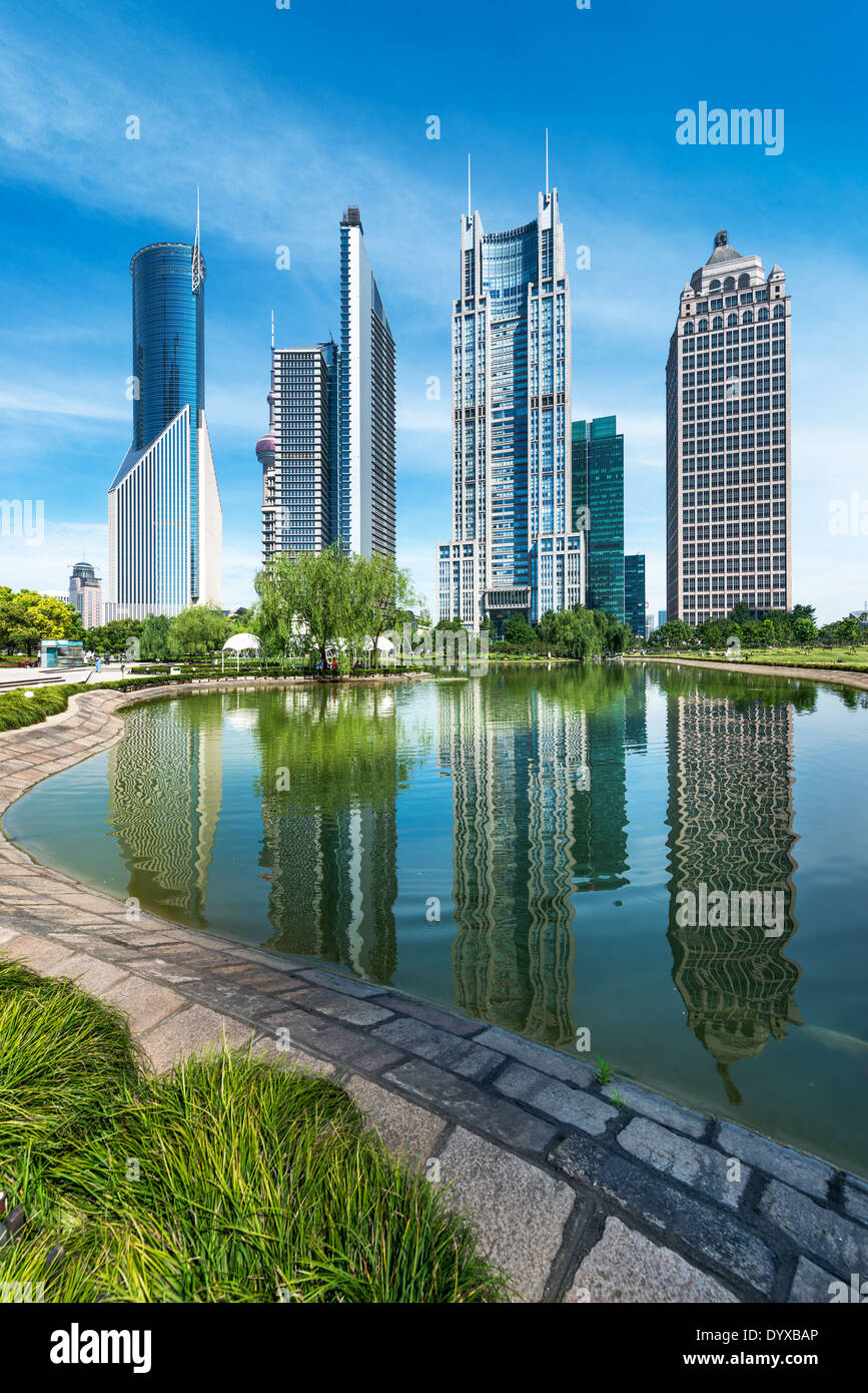 park and skyscrapers under the blue sky in shanghai Stock Photo - Alamy