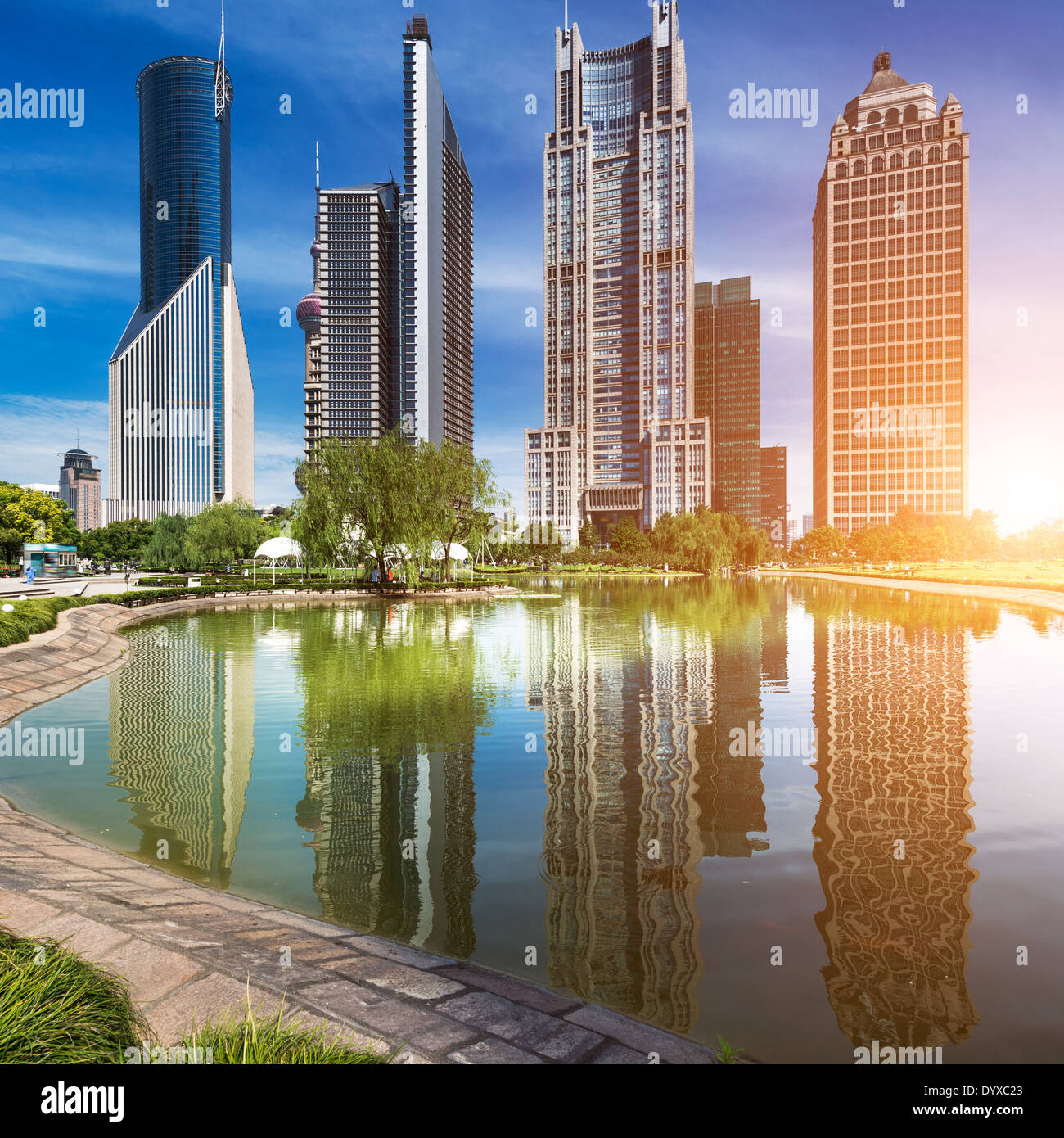 park and skyscrapers under the blue sky in shanghai Stock Photo - Alamy