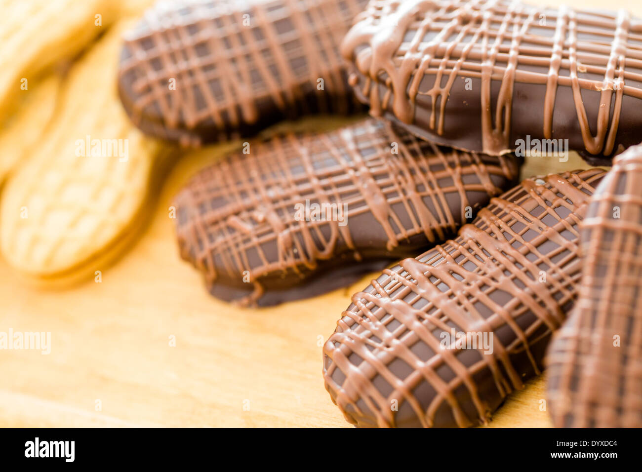 Gourmet Chocolate covered Nutter Butters with chocolate design on top ...