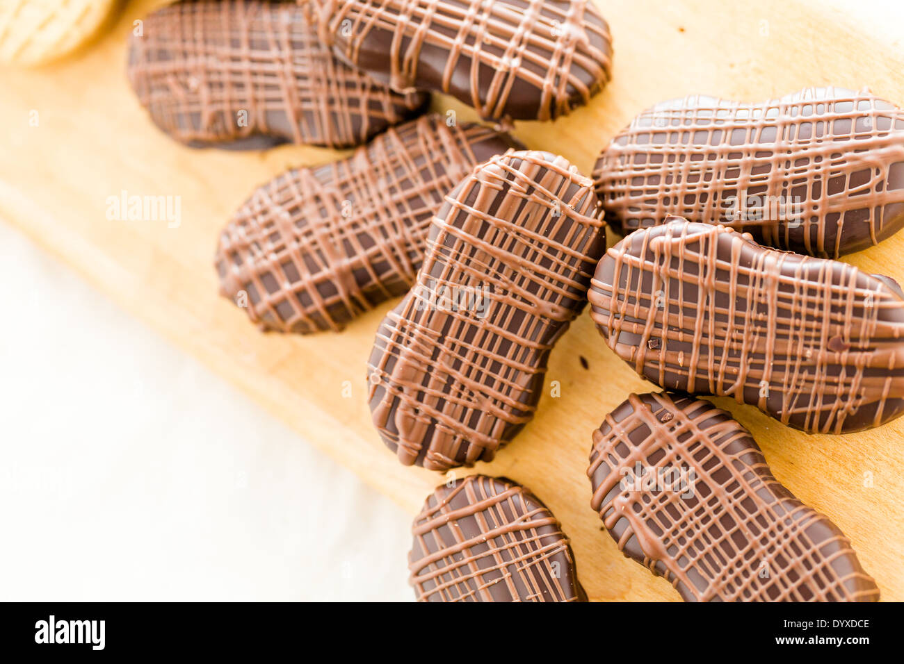 Gourmet Chocolate covered Nutter Butters with chocolate design on top ...