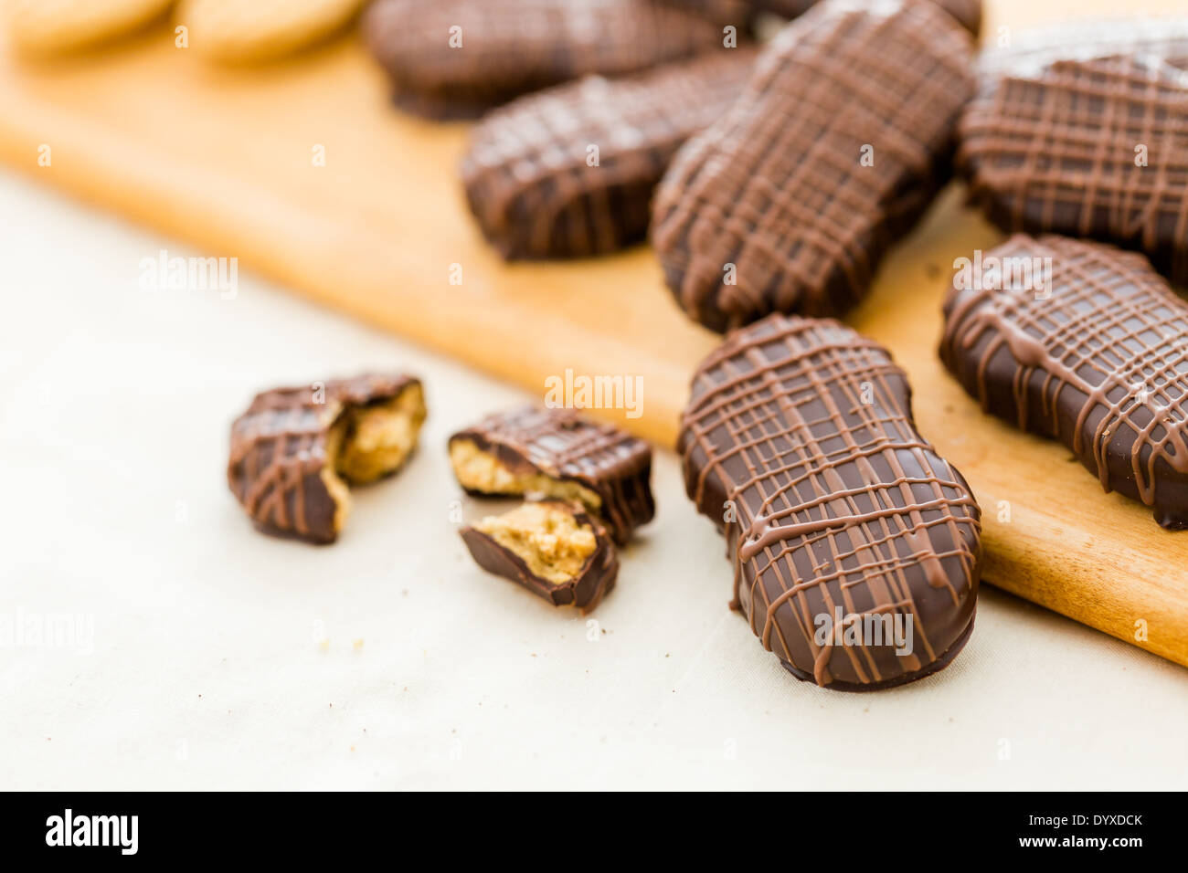 Gourmet Chocolate covered Nutter Butters with chocolate design on top ...